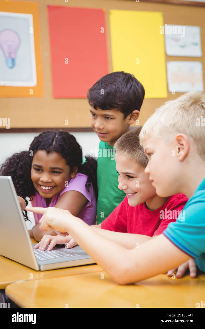 Pupils using a laptop in class Stock Photo - Alamy