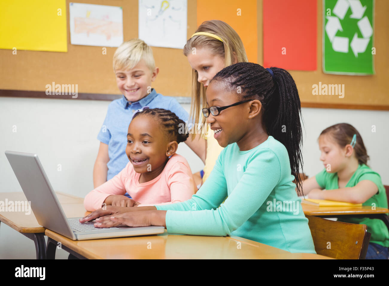 Pupils using a laptop in class Stock Photo - Alamy