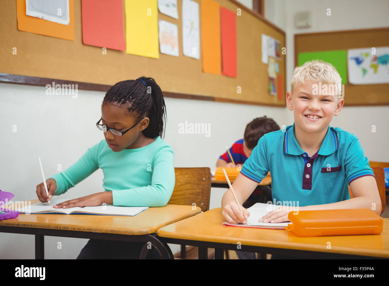 Happy student looking at the camera Stock Photo - Alamy