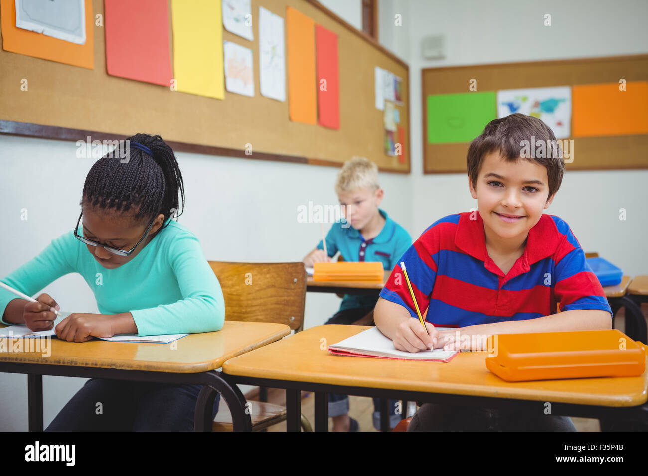 Happy student looking at the camera Stock Photo - Alamy