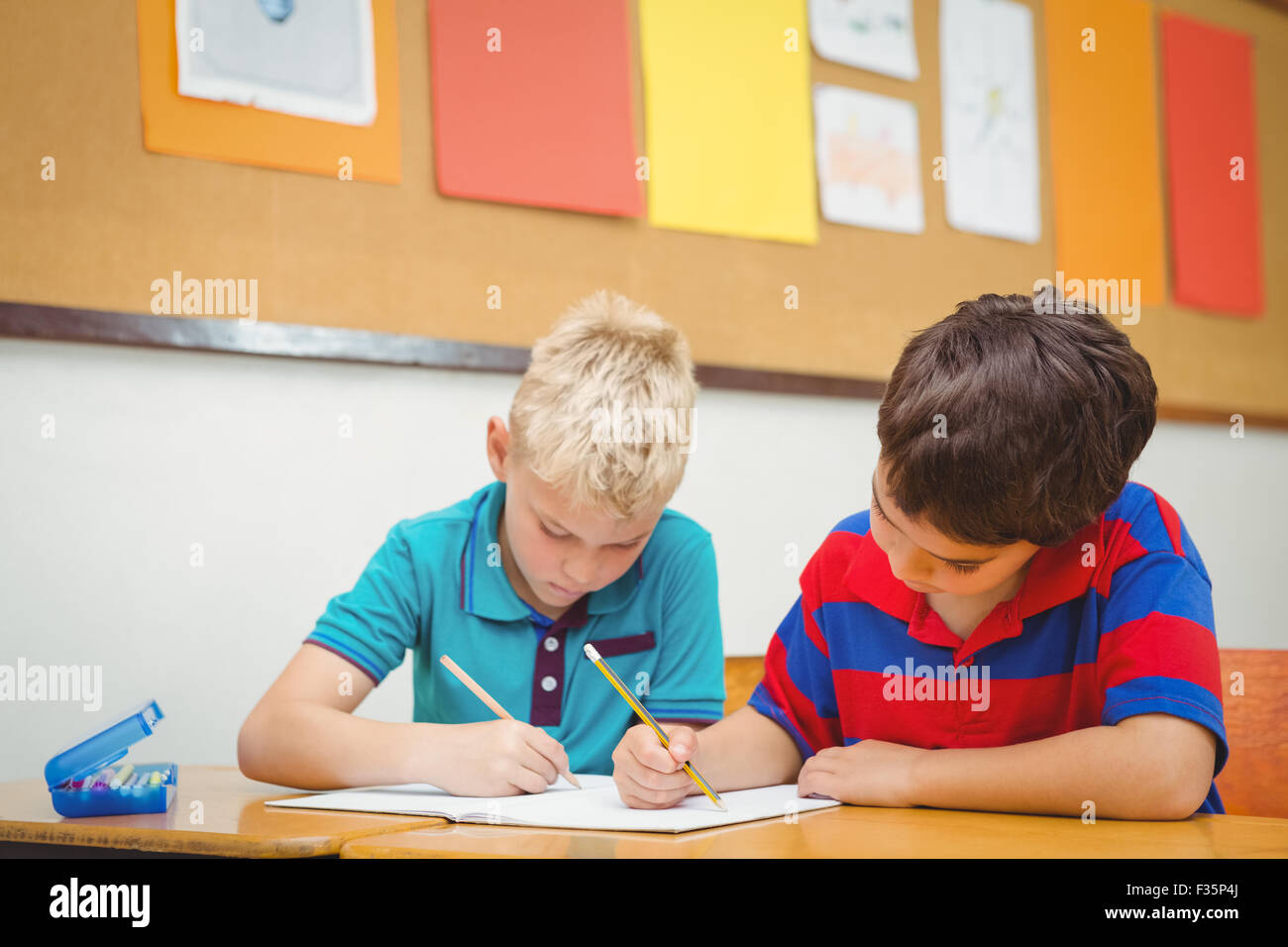 Busy students working on class work Stock Photo - Alamy
