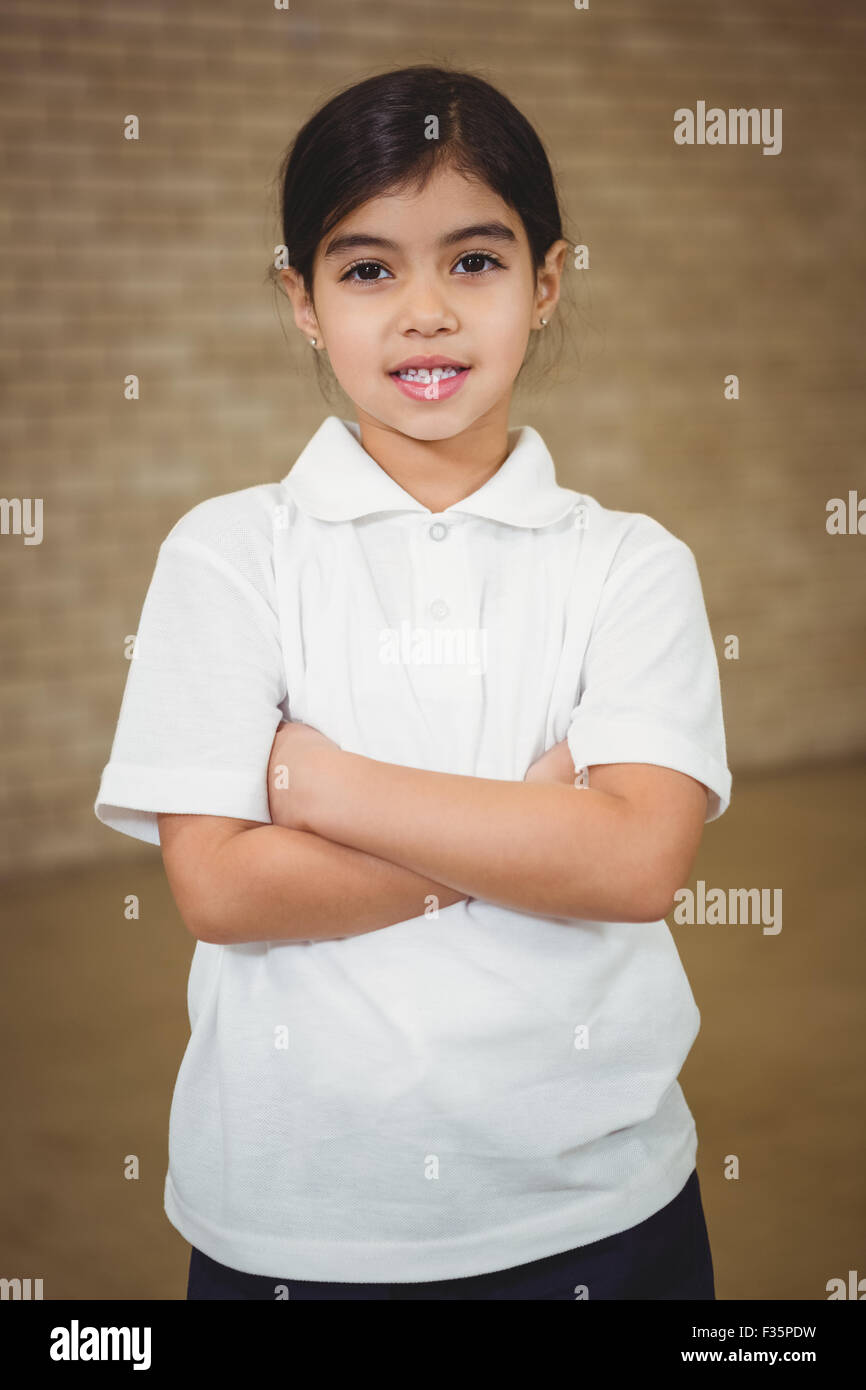 Happy pupil with folded arms Stock Photo - Alamy