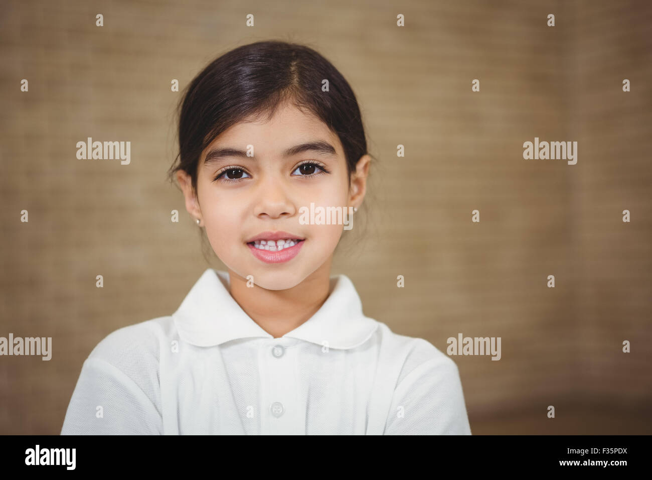 Happy pupil looking at the camera Stock Photo - Alamy