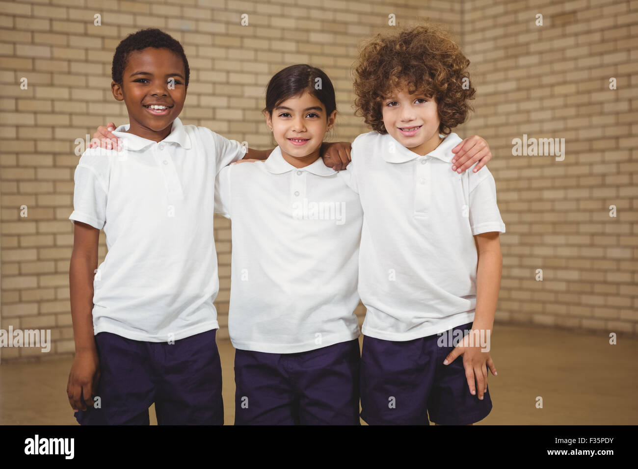 Happy pupils looking at the camera Stock Photo - Alamy