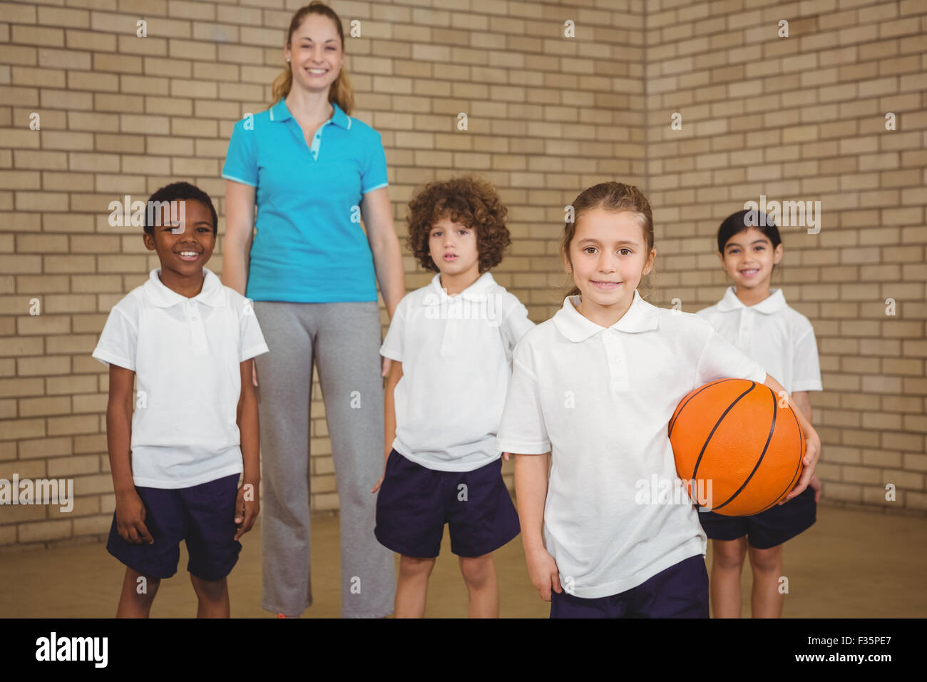 Students together about to play basketball Stock Photo - Alamy
