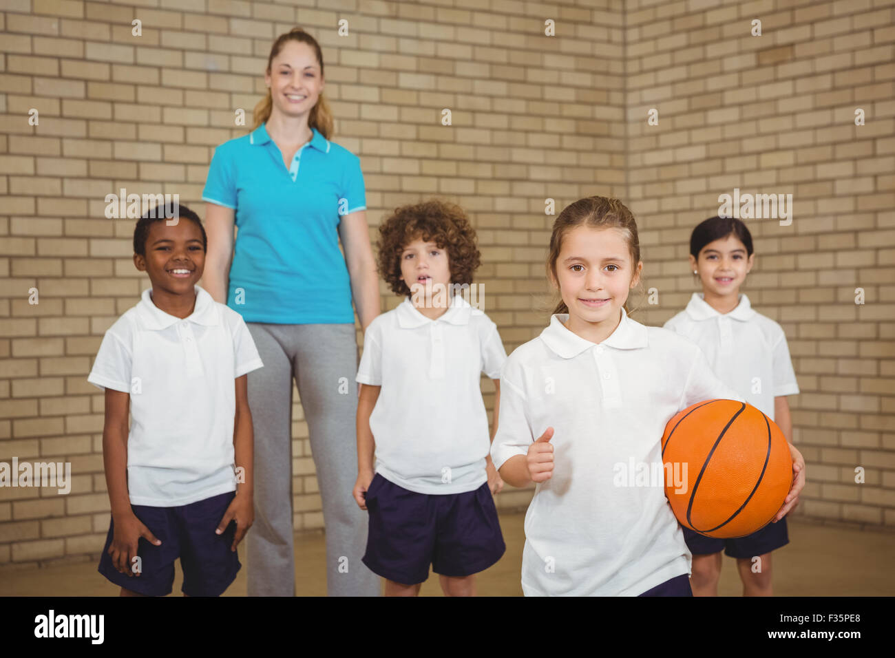 Students together about to play basketball Stock Photo - Alamy