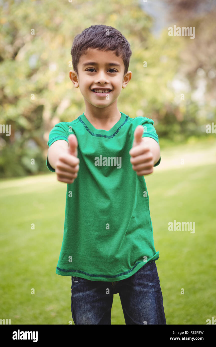 Smiling student with thumbs up Stock Photo - Alamy