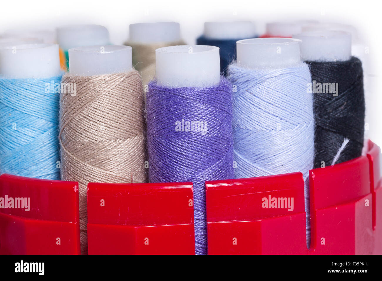 group of colored thread on a white background Stock Photo - Alamy