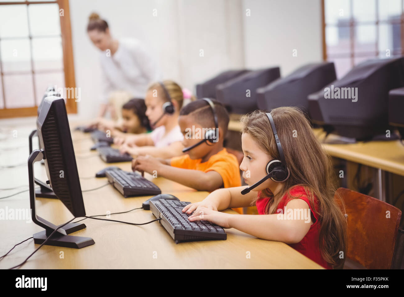 Early computers in school classroom hi-res stock photography and images ...