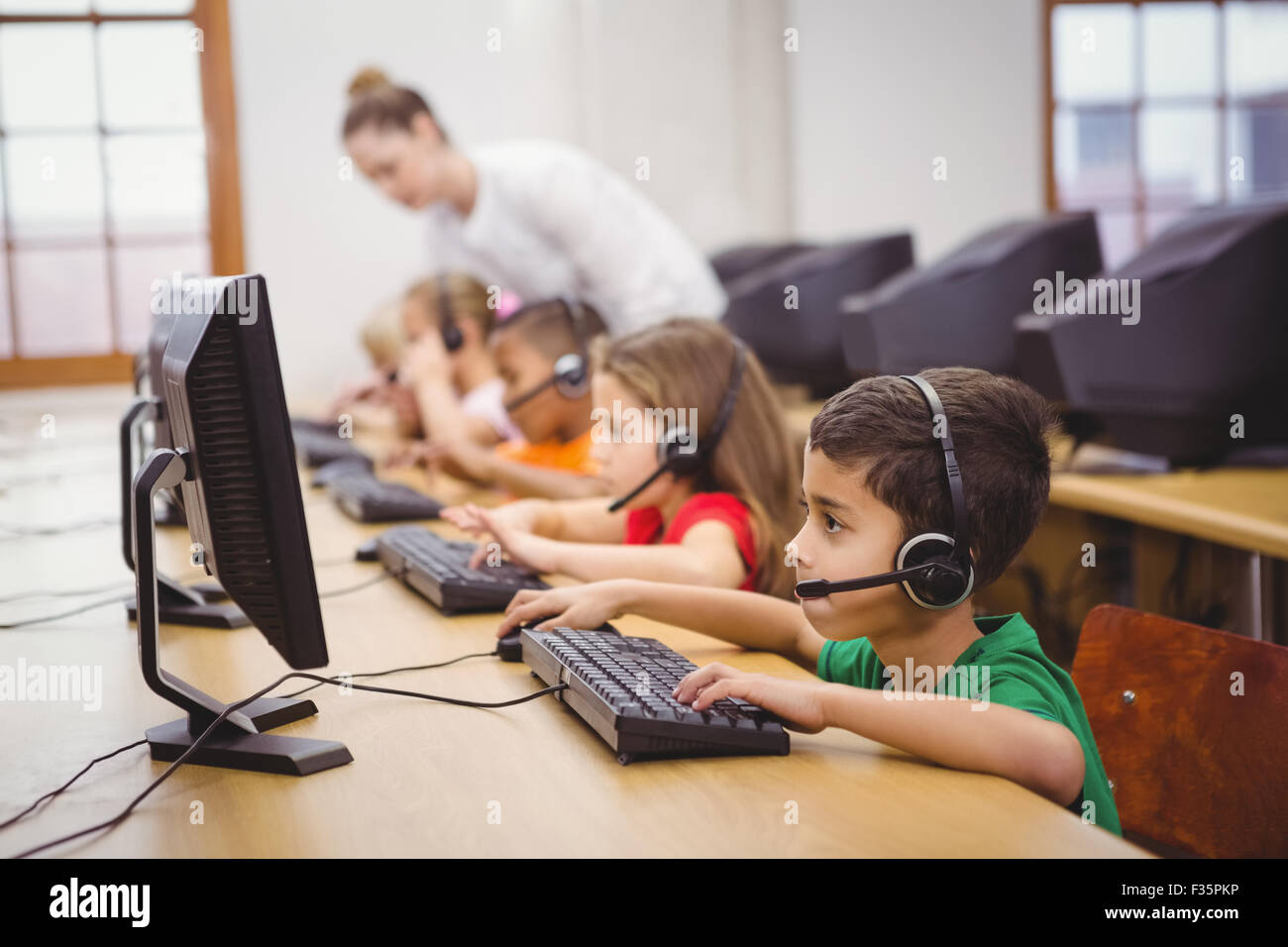 Students using computers in the classroom Stock Photo - Alamy