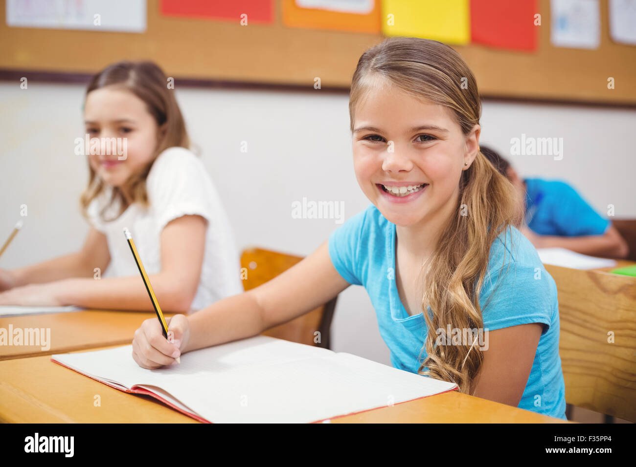 Pupils working at their desk in class Stock Photo - Alamy Pupils working at their desk in class Stock Photo - Alamy