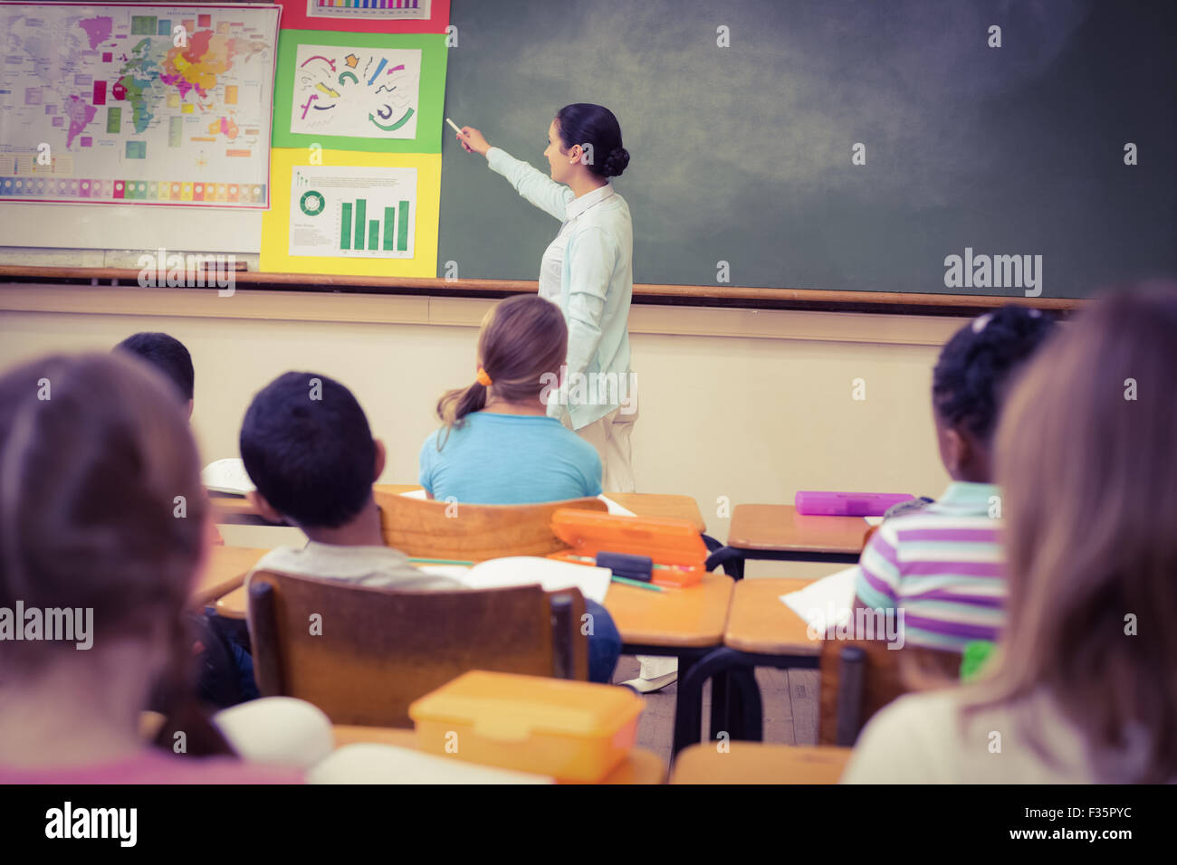 Teacher teaching a lesson in class Stock Photo - Alamy