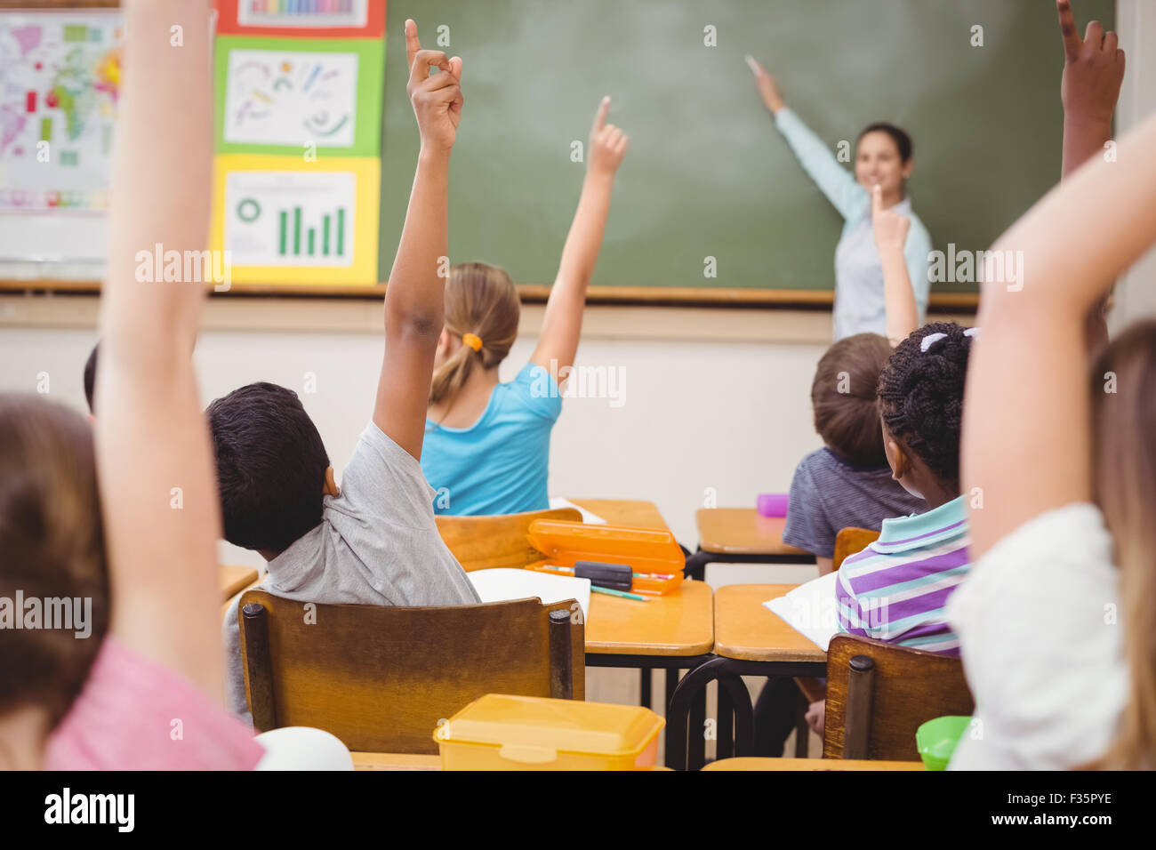 Teacher teaching a lesson in class Stock Photo - Alamy