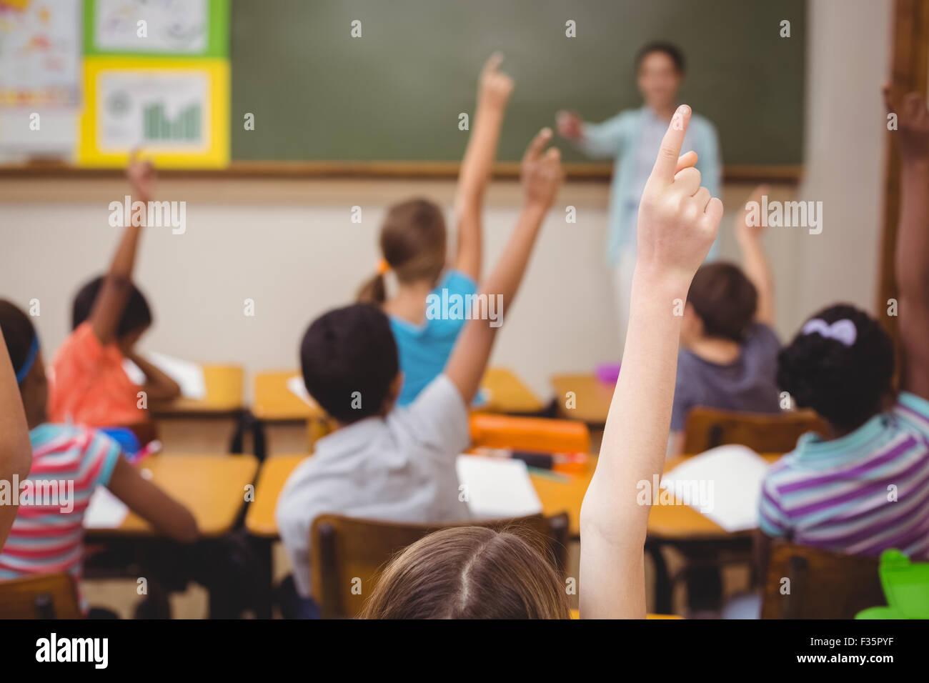 Teacher teaching a lesson in class Stock Photo - Alamy