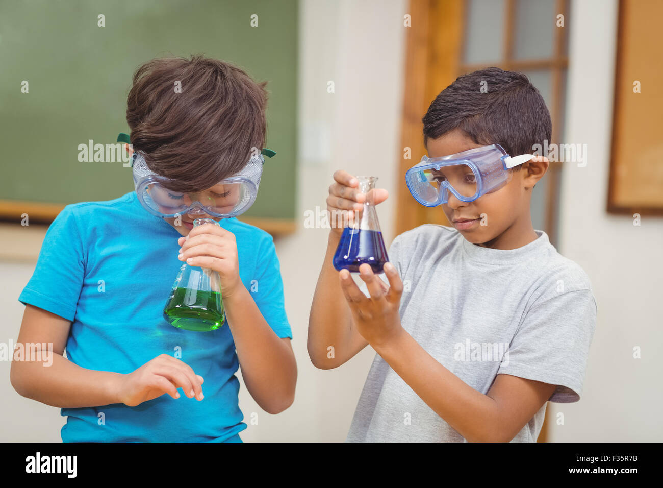 Pupils at science lesson in classroom Stock Photo - Alamy