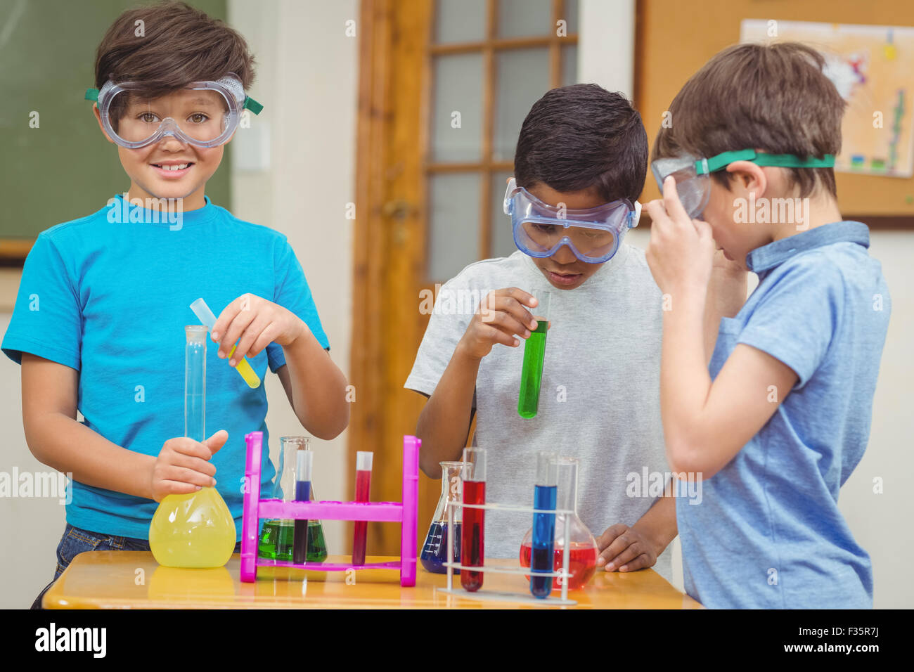Pupils at science lesson in classroom Stock Photo - Alamy
