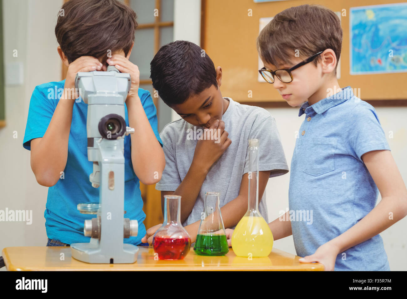 Pupils at science lesson in classroom Stock Photo - Alamy