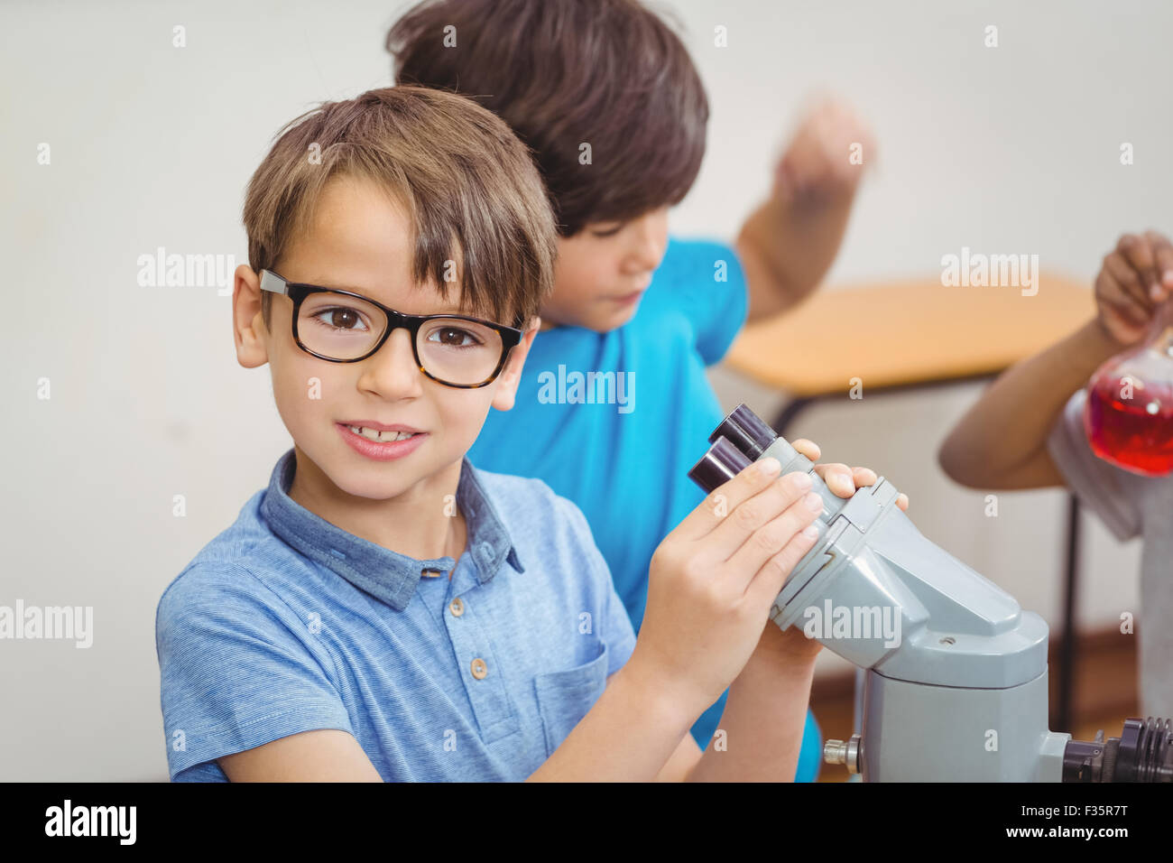 Pupils at science lesson in classroom Stock Photo - Alamy