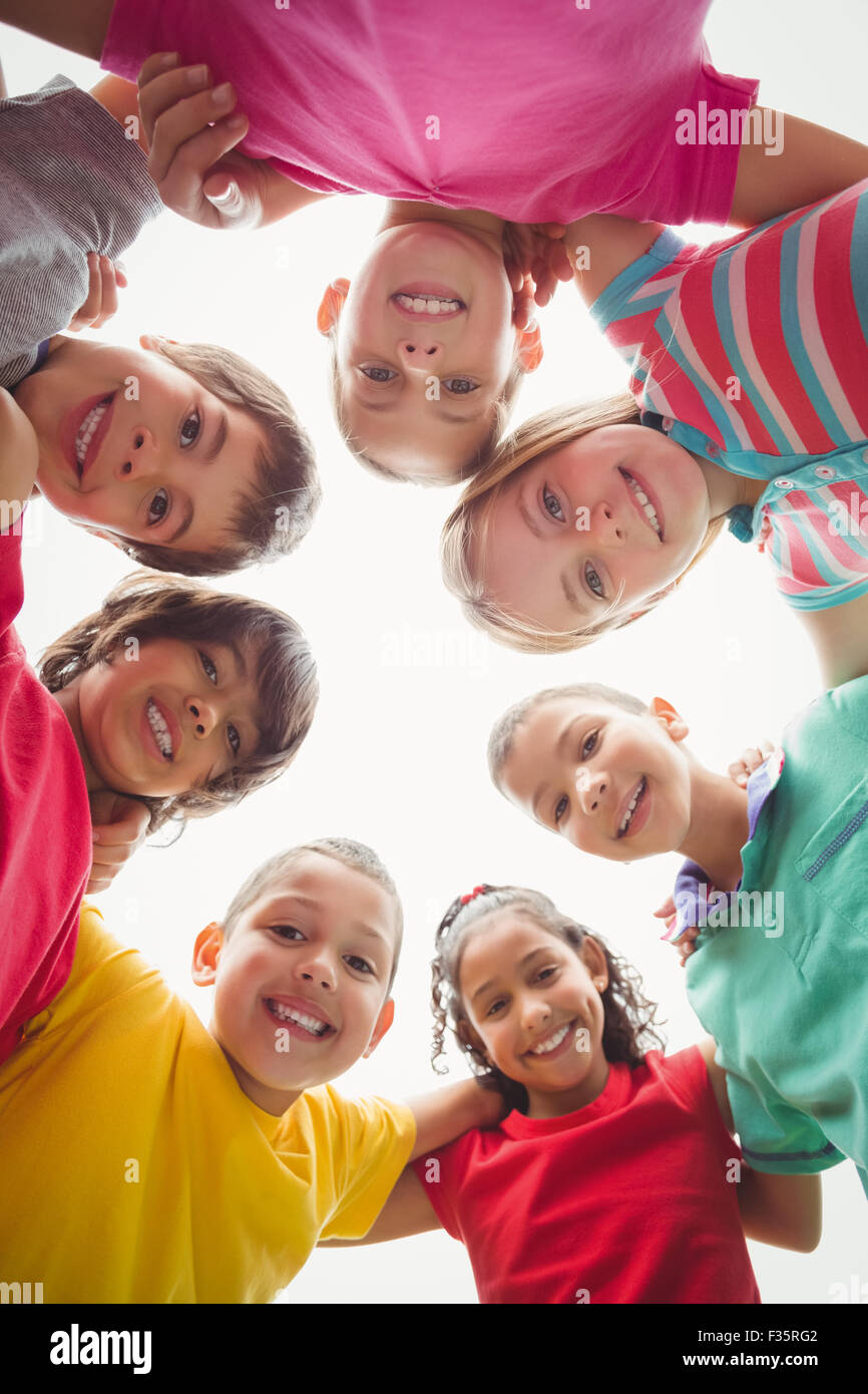 Cute pupils in a huddle Stock Photo - Alamy