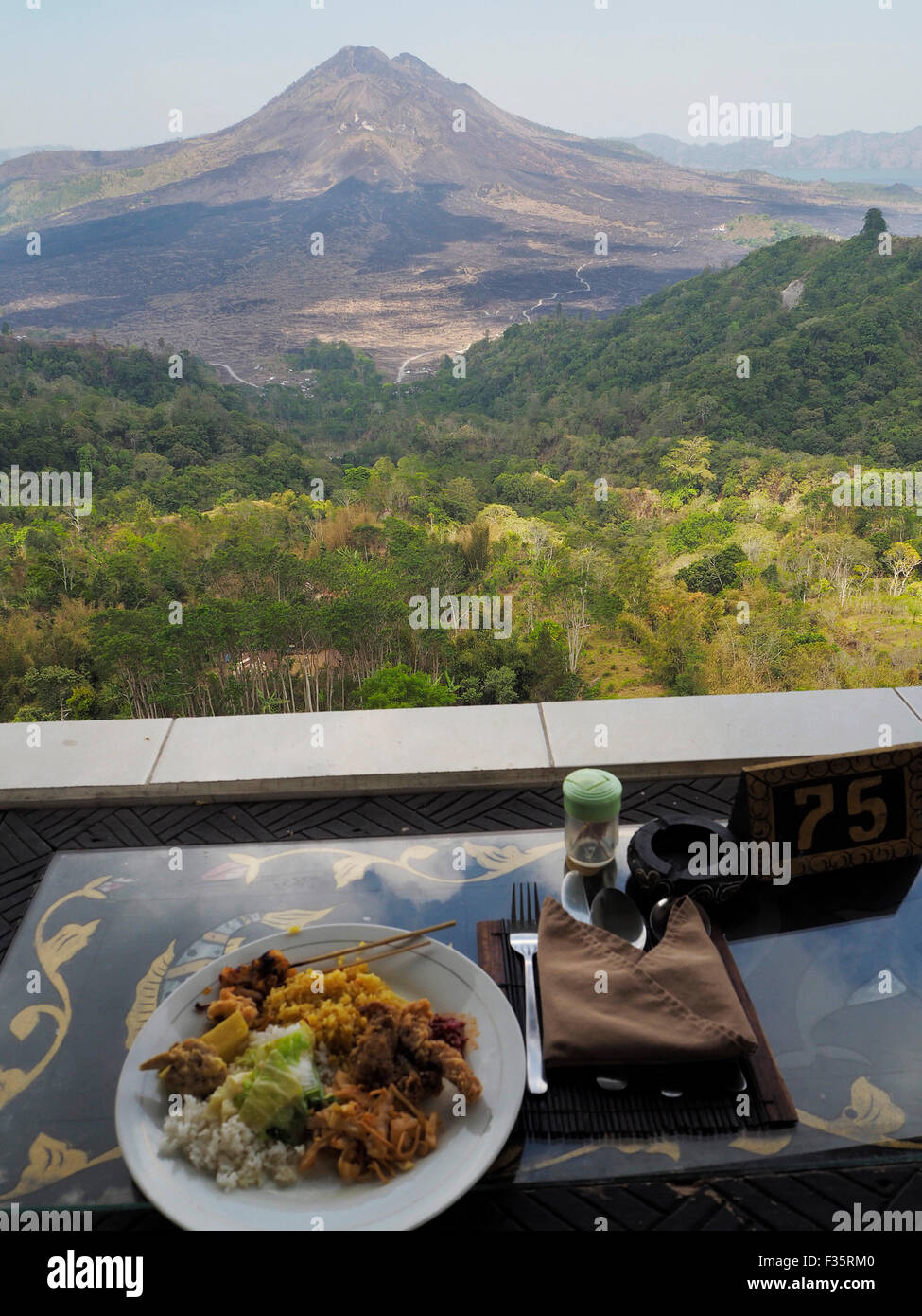 Lunch with a magnificent view of Mount Kintamani in Bali Stock Photo ...