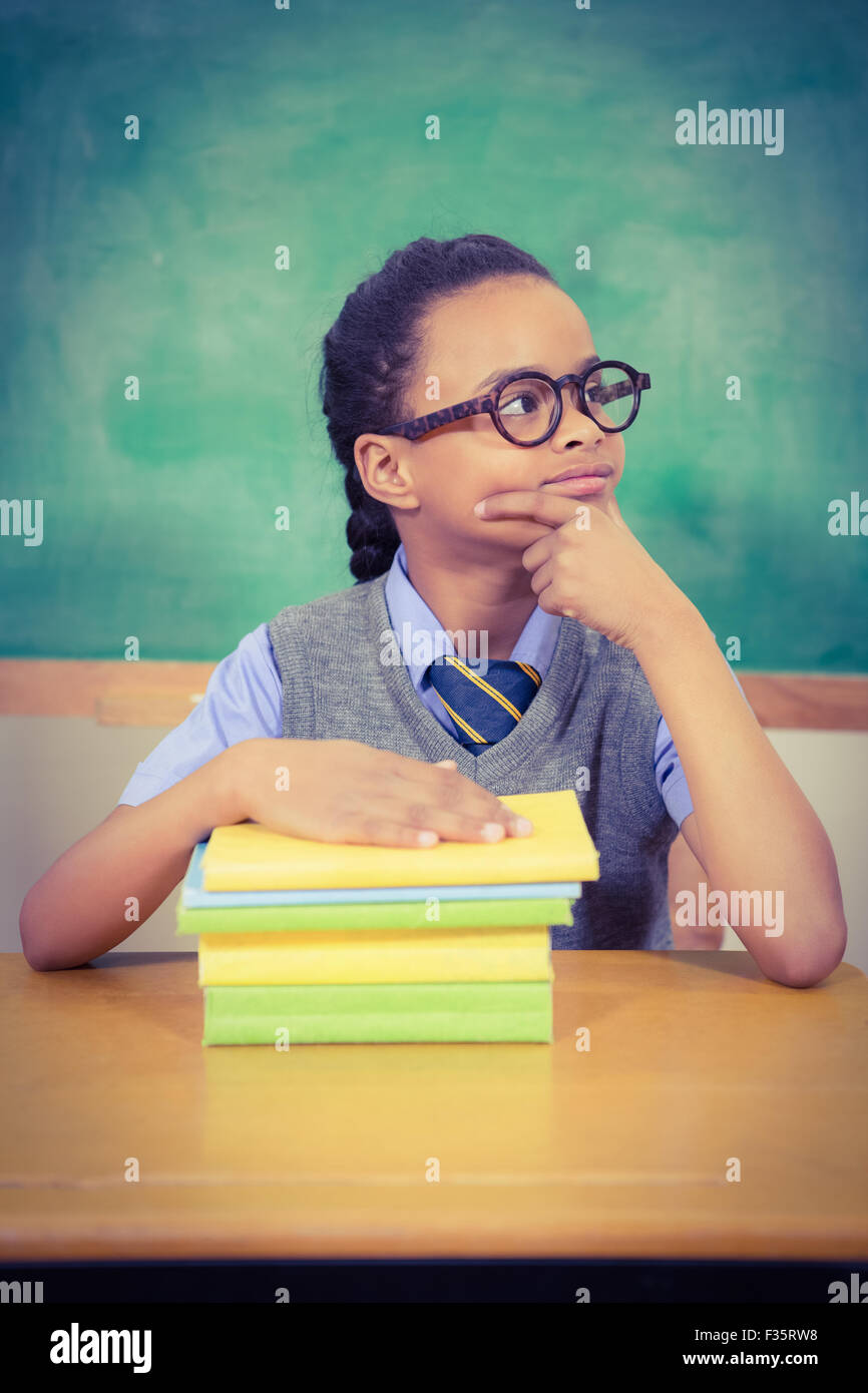 Smiling smart student with books Stock Photo - Alamy