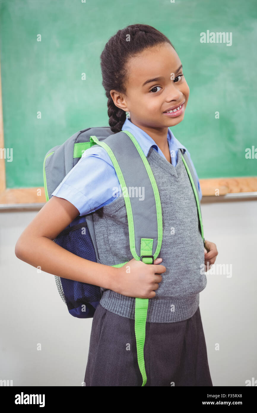 Student smiling and wearing a school bag Stock Photo - Alamy
