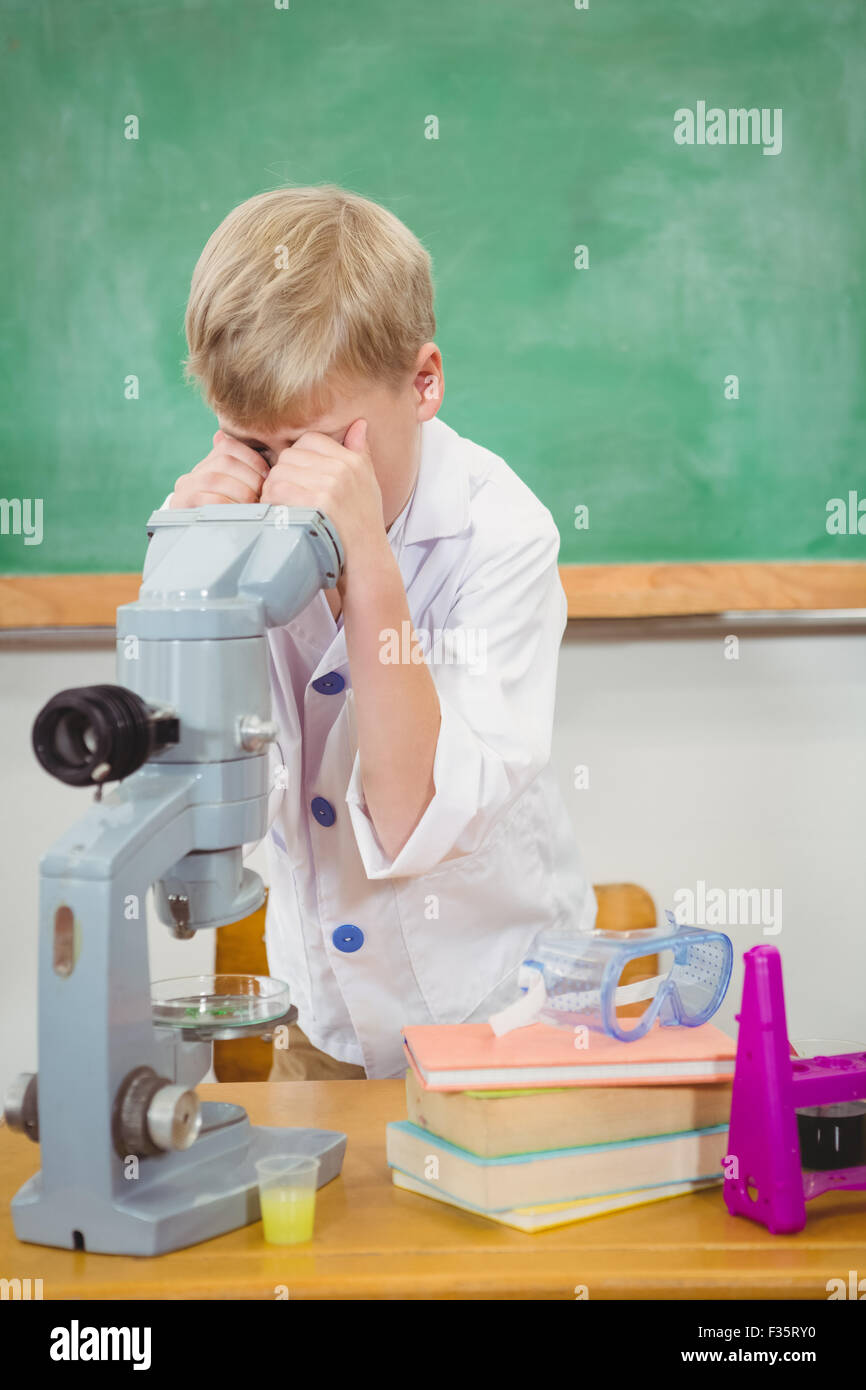 Student using a microscope and chemistry set Stock Photo - Alamy