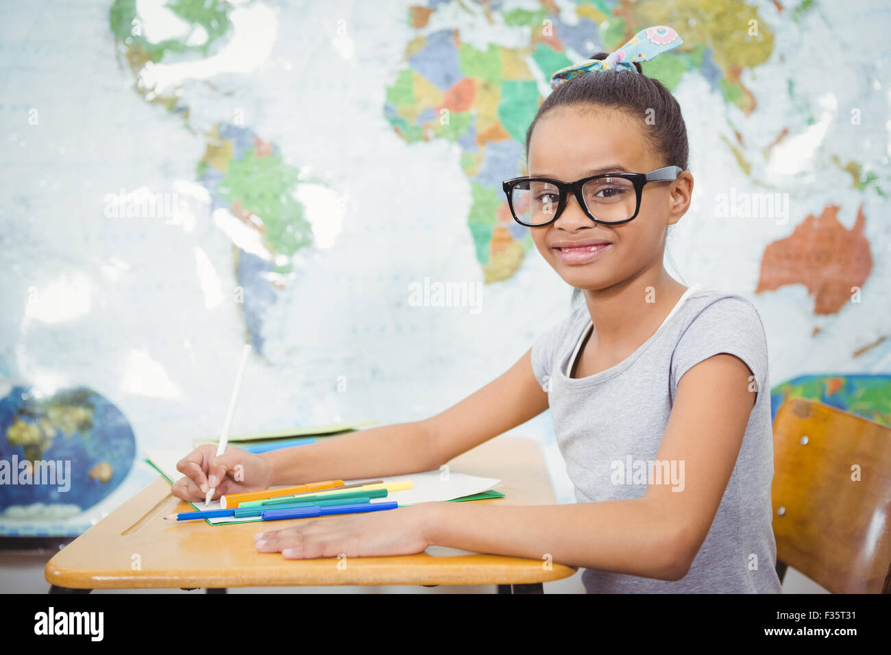 Smiling student doing class work Stock Photo - Alamy