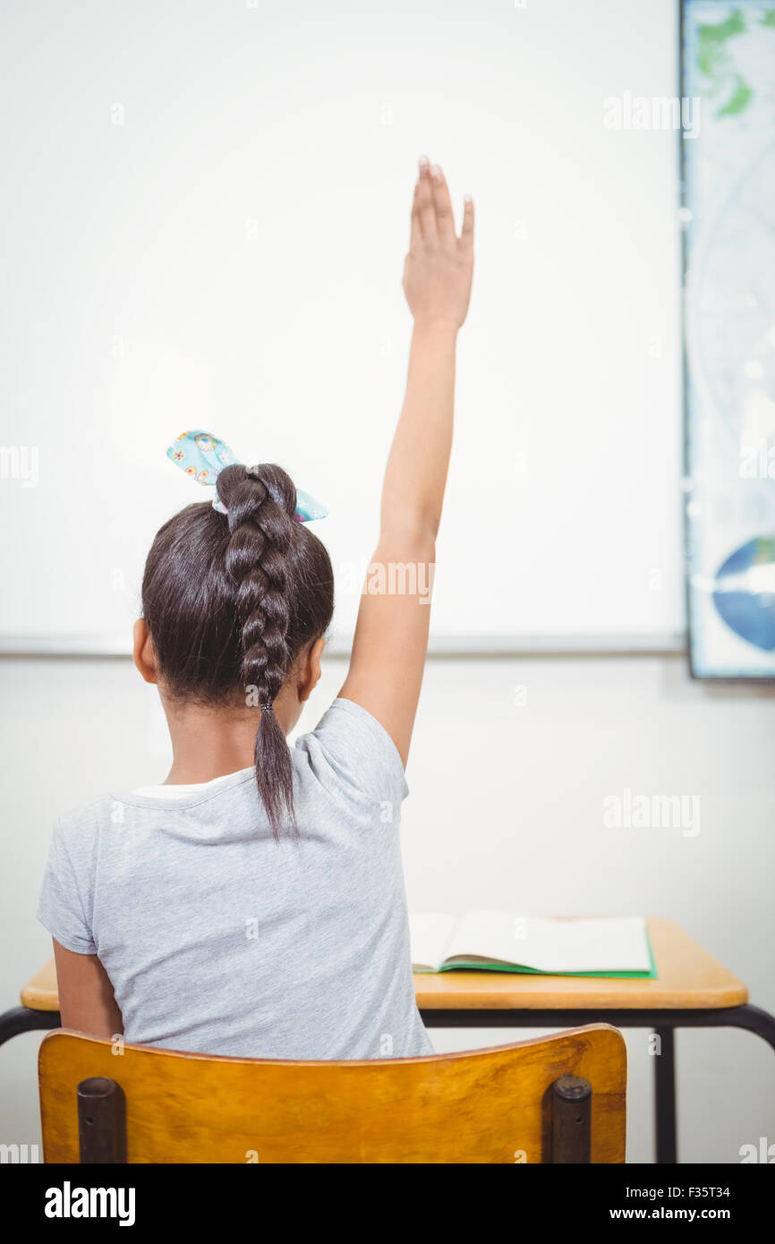 Students raising hands to answer a question Stock Photo - Alamy