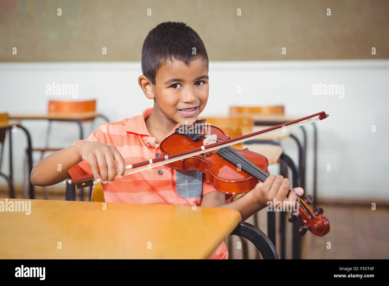 Mixed race student playing violin hi-res stock photography and images ...