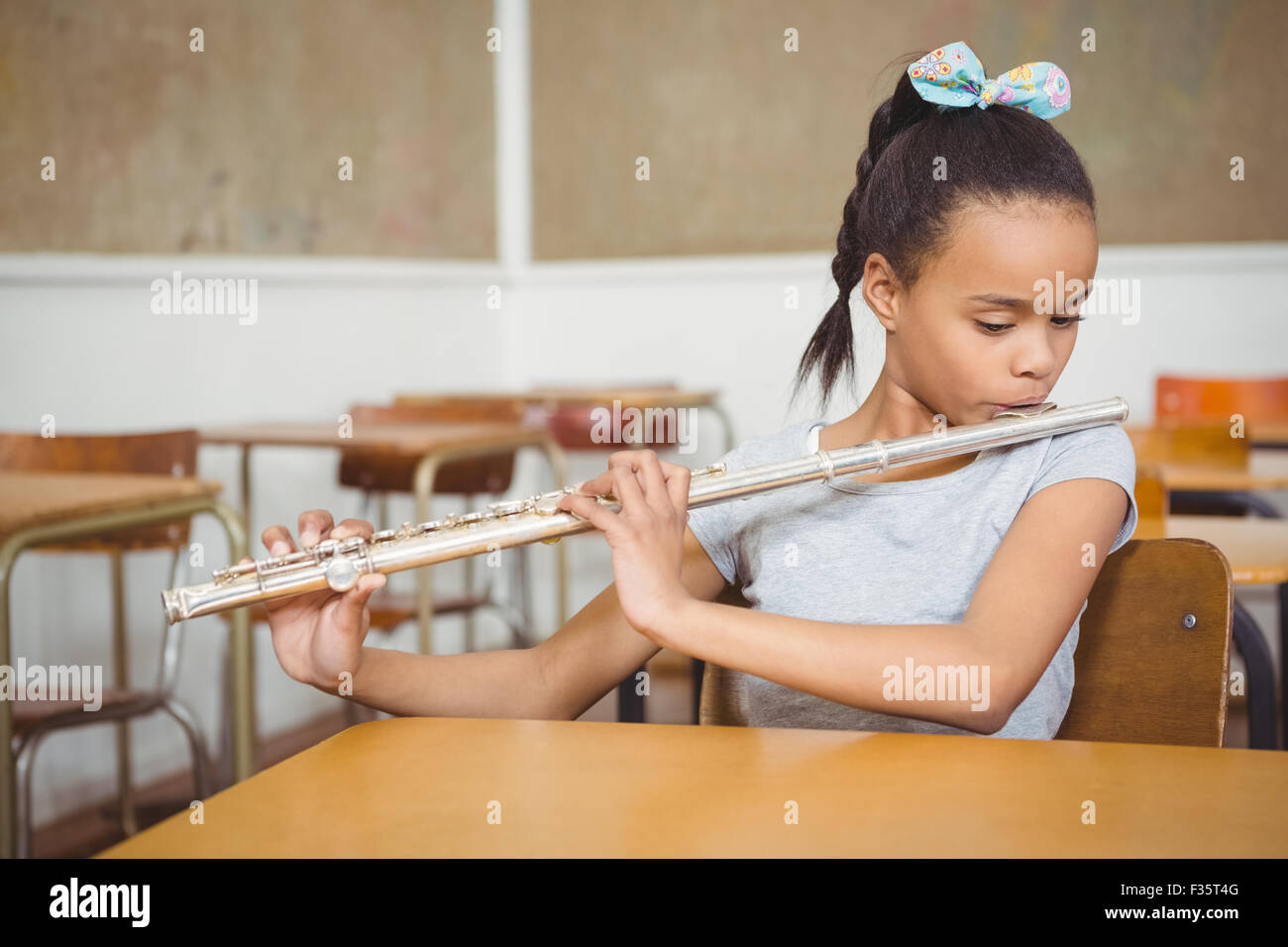Student using a flute in class Stock Photo - Alamy