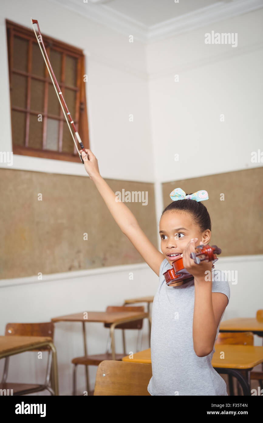Student using a violin in class Stock Photo - Alamy
