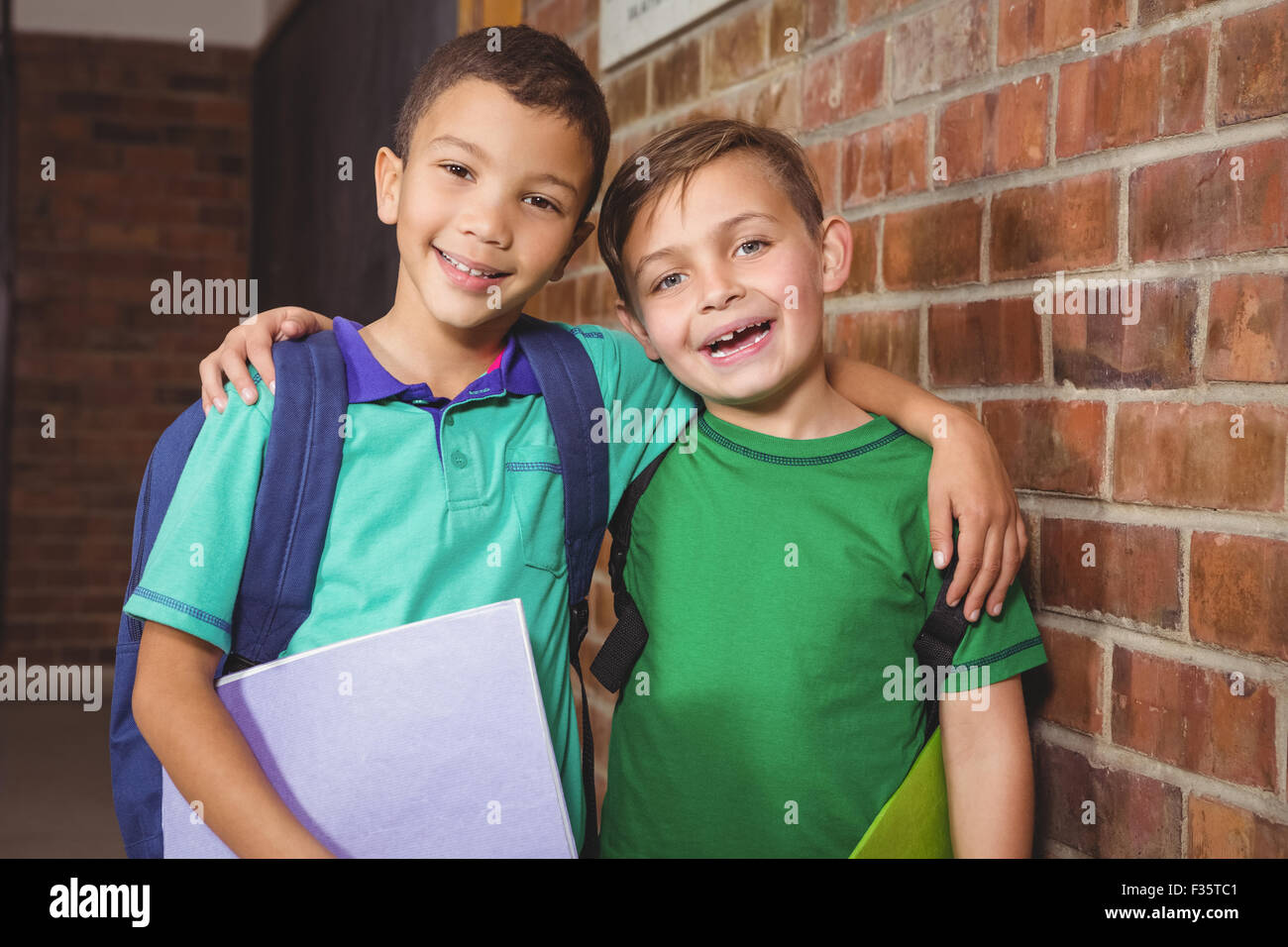 Smiling happy students looking at the camera Stock Photo - Alamy