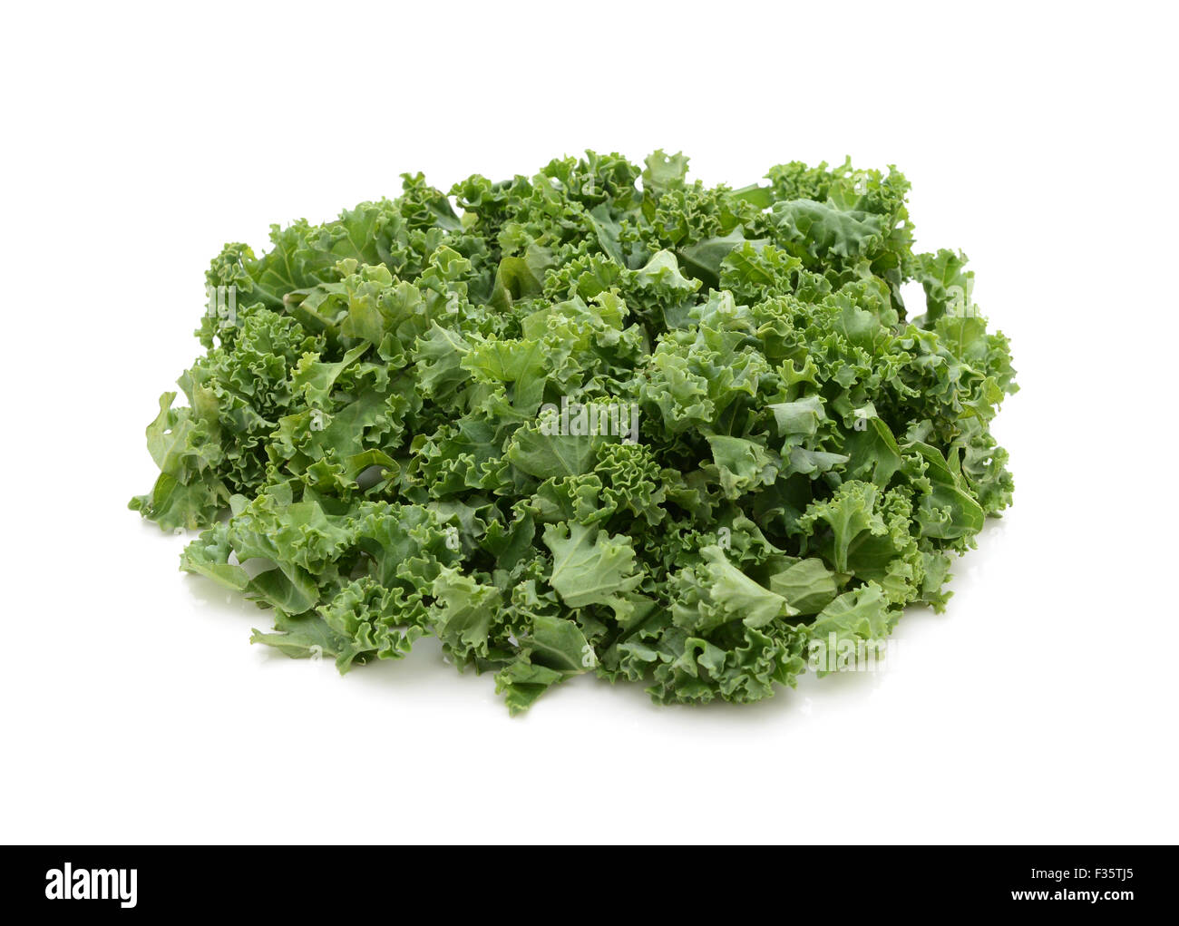 Chopped kale, isolated on a white background Stock Photo - Alamy