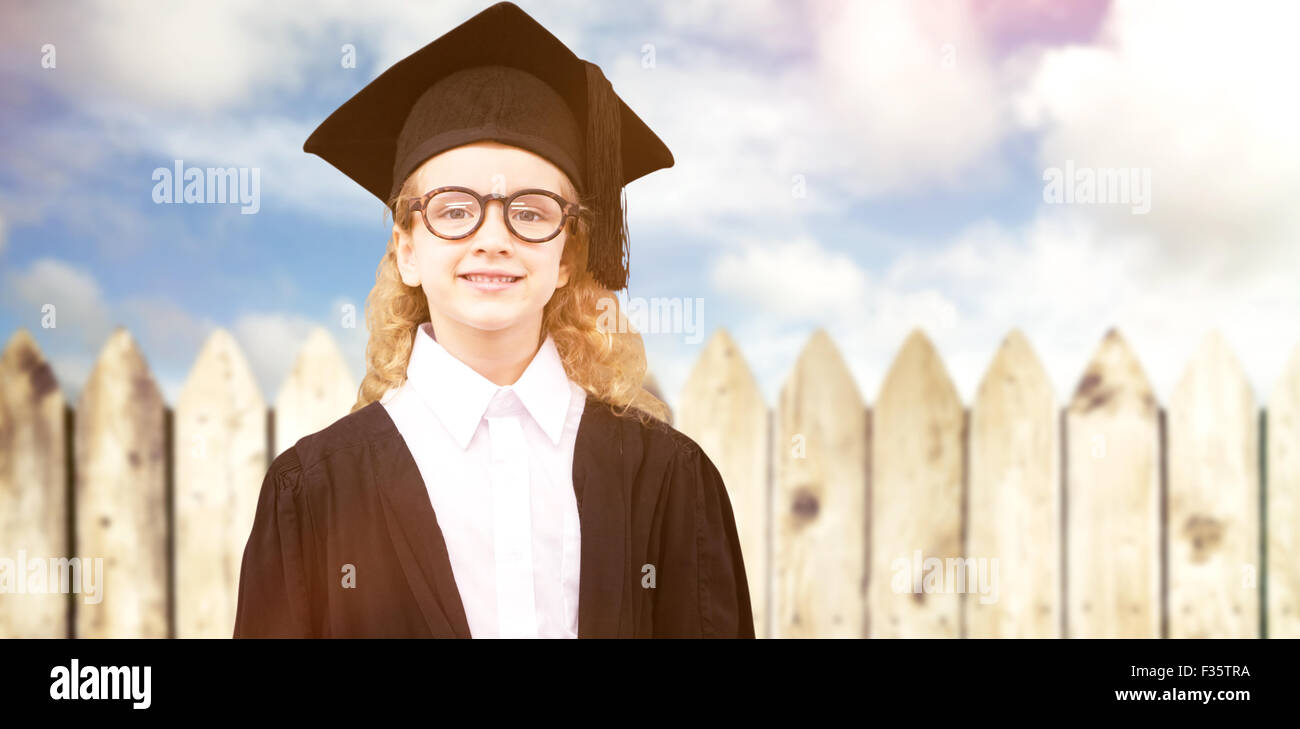 Composite image of cute pupil in graduation robe Stock Photo - Alamy