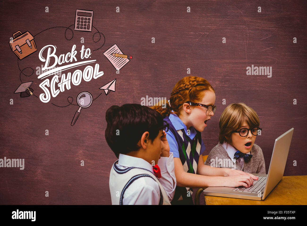Composite image of pupils using laptop Stock Photo - Alamy
