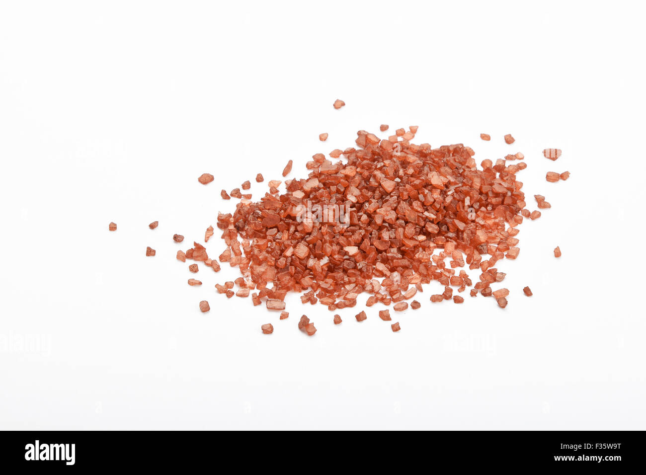 Handful of red Hawaiian sea salt isolated on white background Stock ...