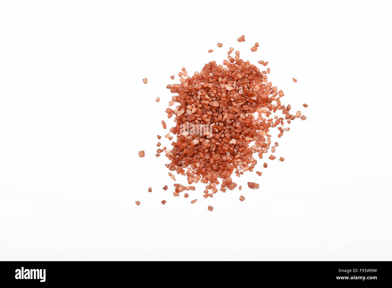 Handful of red Hawaiian sea salt isolated on white background Stock ...