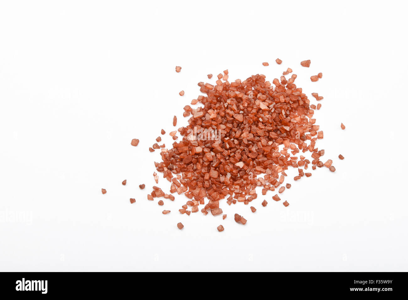 Handful of red Hawaiian sea salt isolated on white background Stock ...