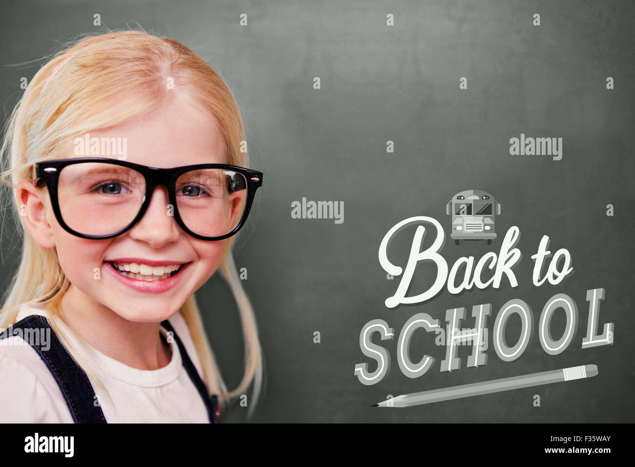 Composite image of cute pupil smiling Stock Photo - Alamy