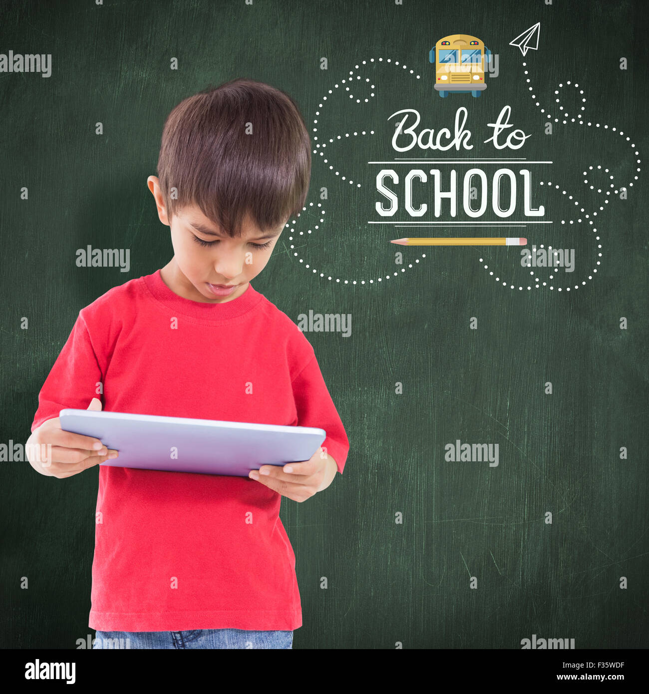 Composite image of cute boy using tablet Stock Photo - Alamy