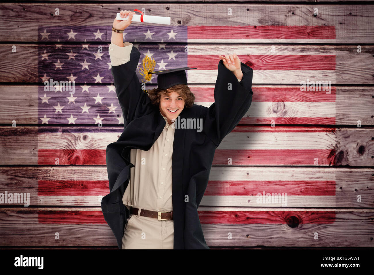 Happy jumping graduate holding diploma hi-res stock photography and ...