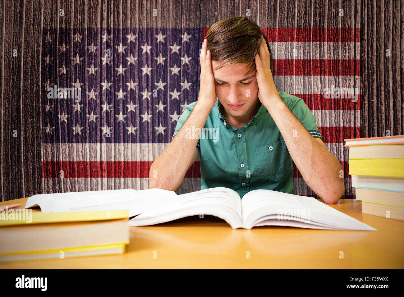 Composite image of student sitting in library reading Stock Photo - Alamy