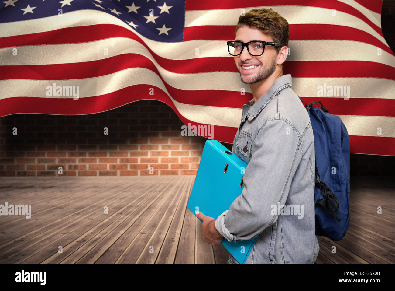 Composite image of student smiling at camera in library Stock Photo - Alamy