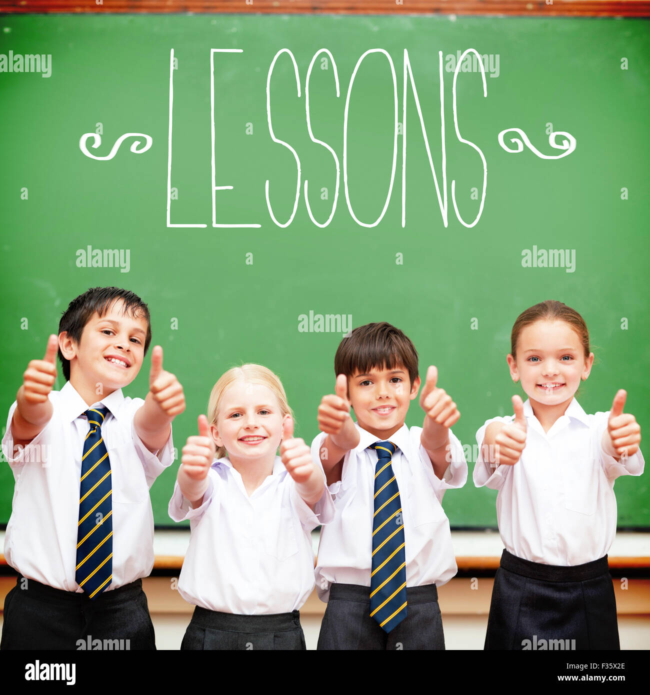 Lessons against cute pupils showing thumbs up in classroom Stock Photo ...