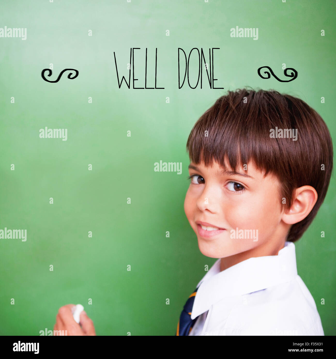 Well-done! against cute pupil holding chalk Stock Photo - Alamy