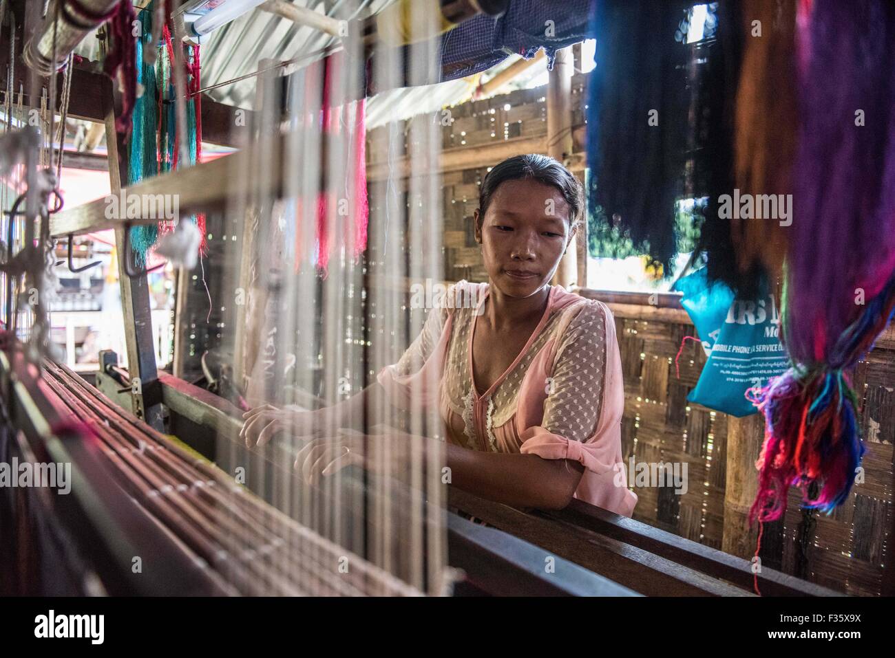 A woman works at a loom in Kachin State, Myanmar Stock Photo - Alamy