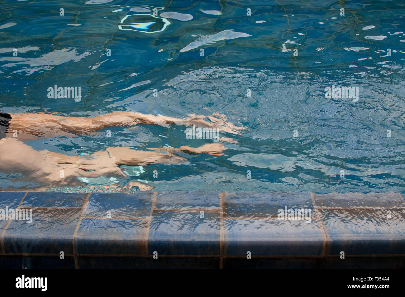 swimmer's legs in swimming pool Stock Photo - Alamy