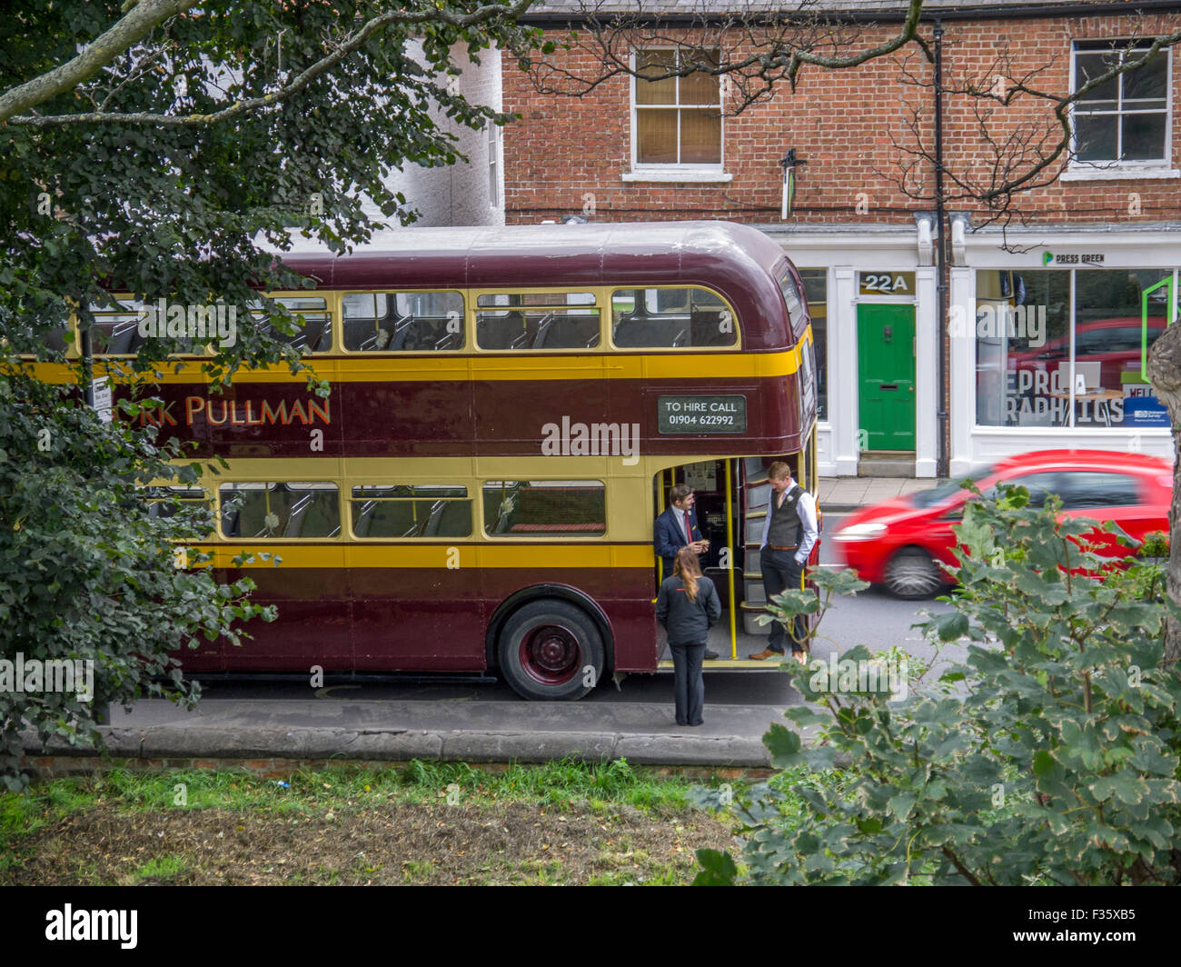Old Pullman bus parked up in York, with staff chatting on a break Stock ...