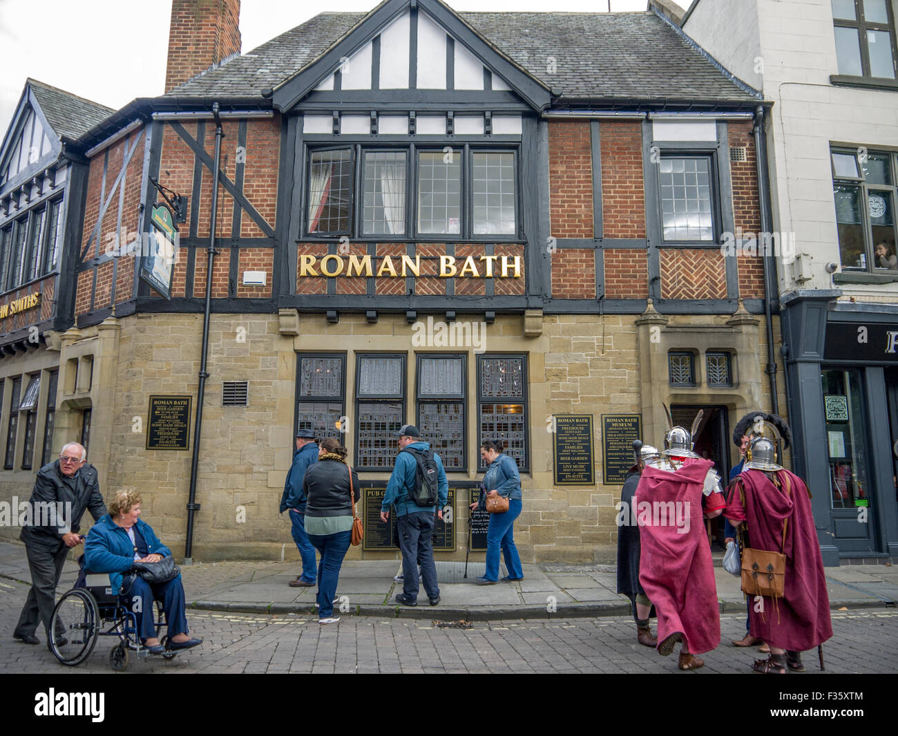 Roman soldiers outside a public house called Roman Bath in York Stock ...